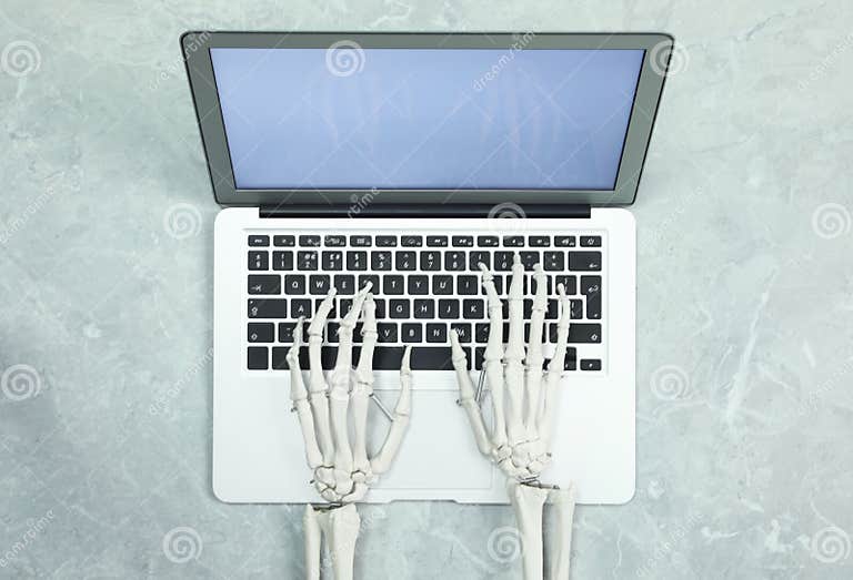 Human Skeleton Using Laptop at Grey Marble Table, Top View Stock Photo ...