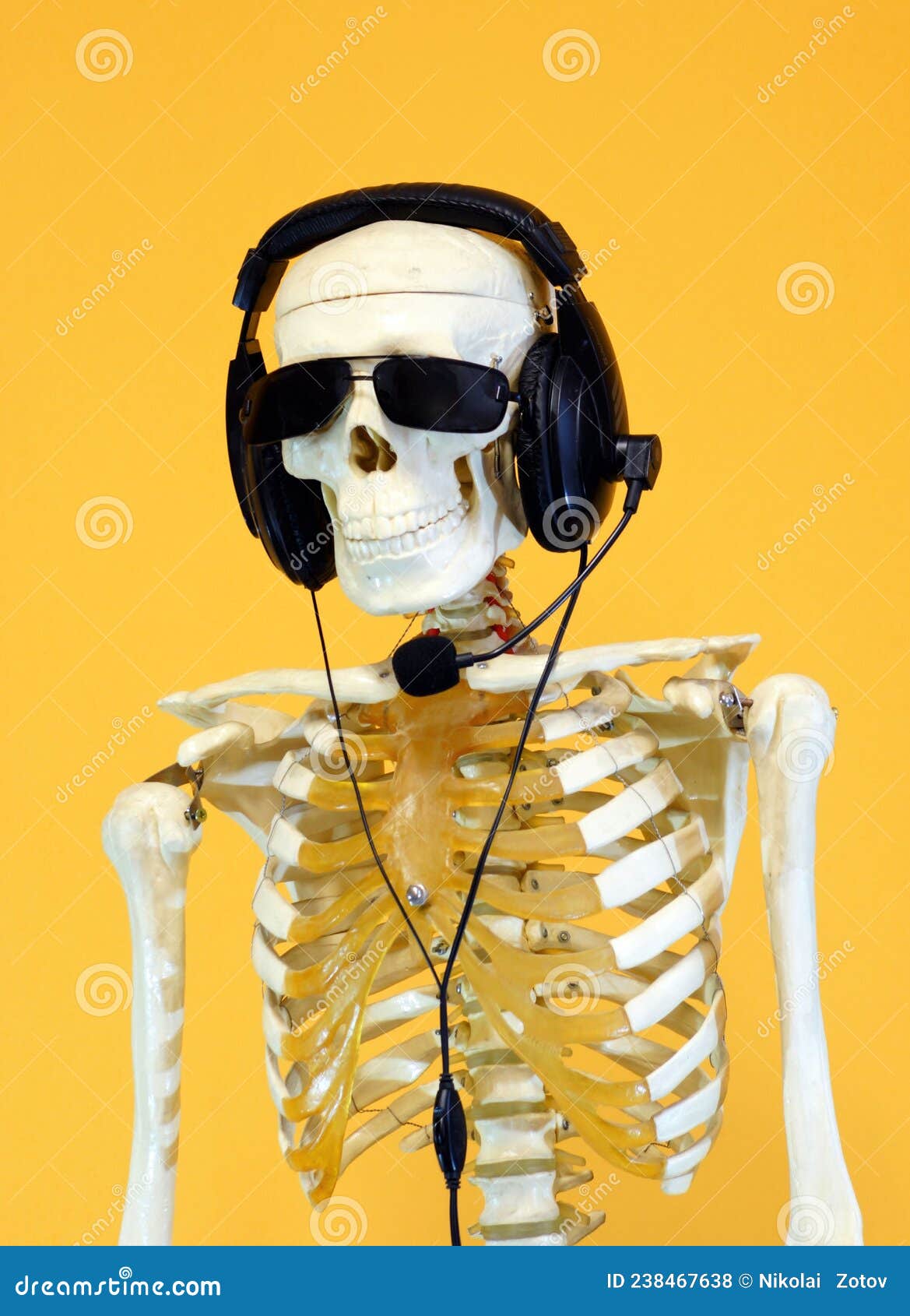 A Human Skeleton Wearing Headphones with a Microphone. Stock Photo ... A Human Skeleton Wearing Headphones with a Microphone. Stock Photo ...