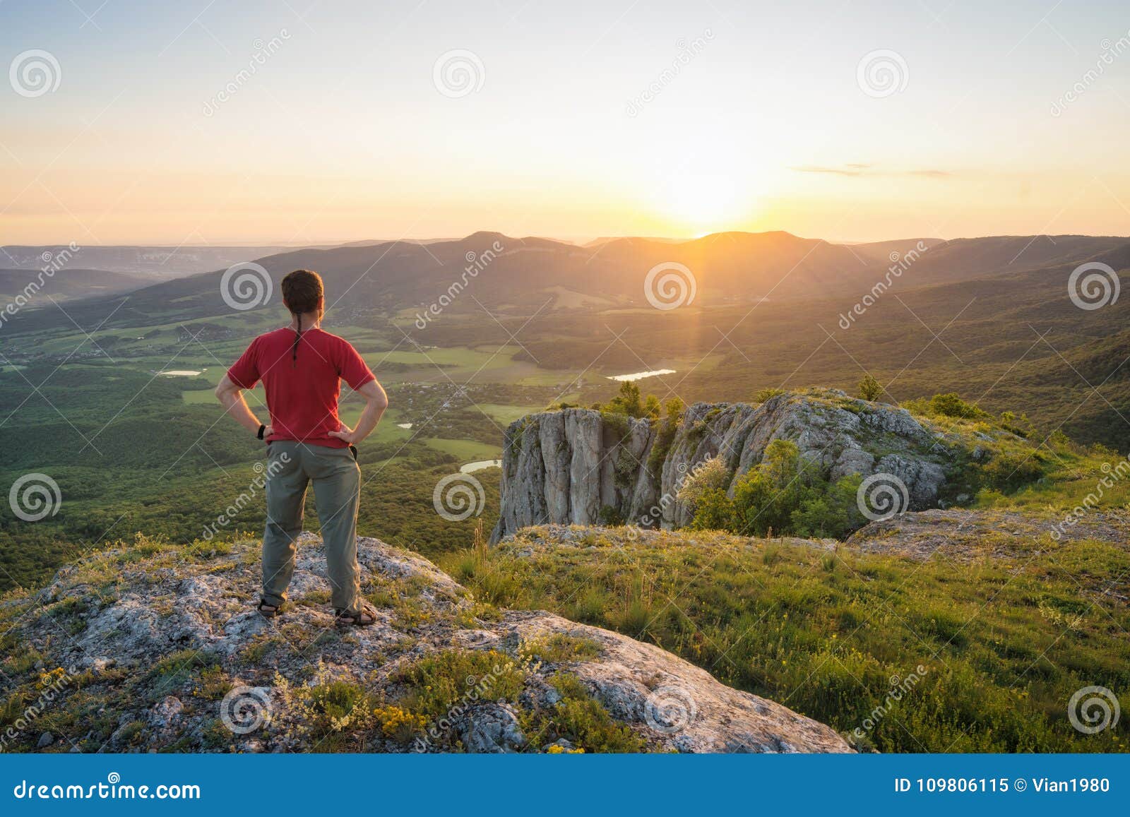 Human Standing on a Rocky Hill in a Light of Sunset Stock Image - Image ...