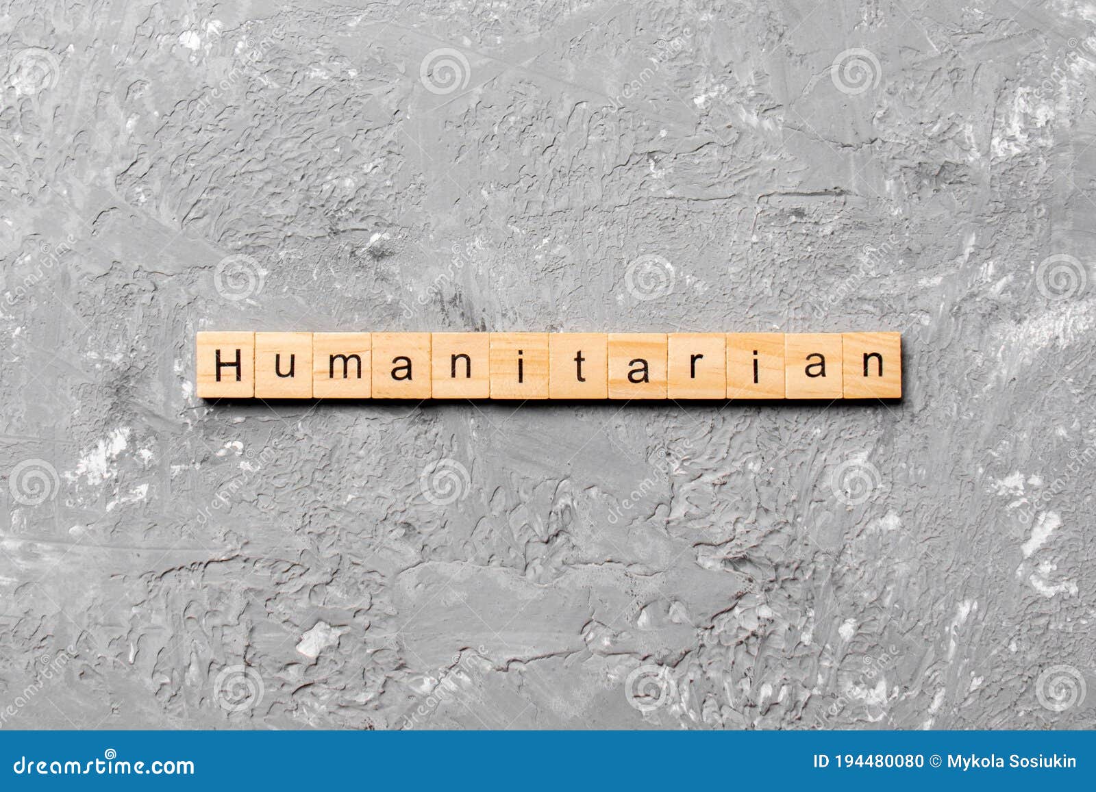 Humanitarian Word Written on Wood Block. Humanitarian Text on Table ...