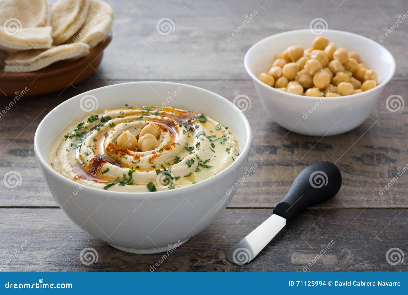 Hummus in Bowl on Rustic Wood Stock Photo - Image of snack, east: 71125994