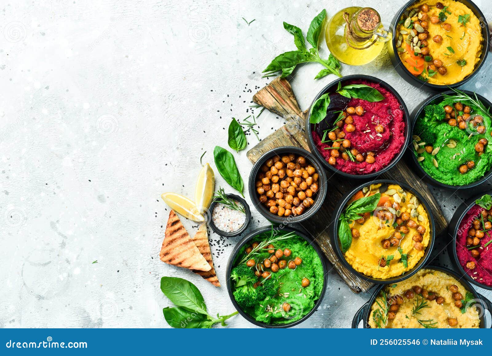 Hummus Bowls Background. Traditional Hummus, Herb Hummus, Beetroot ...