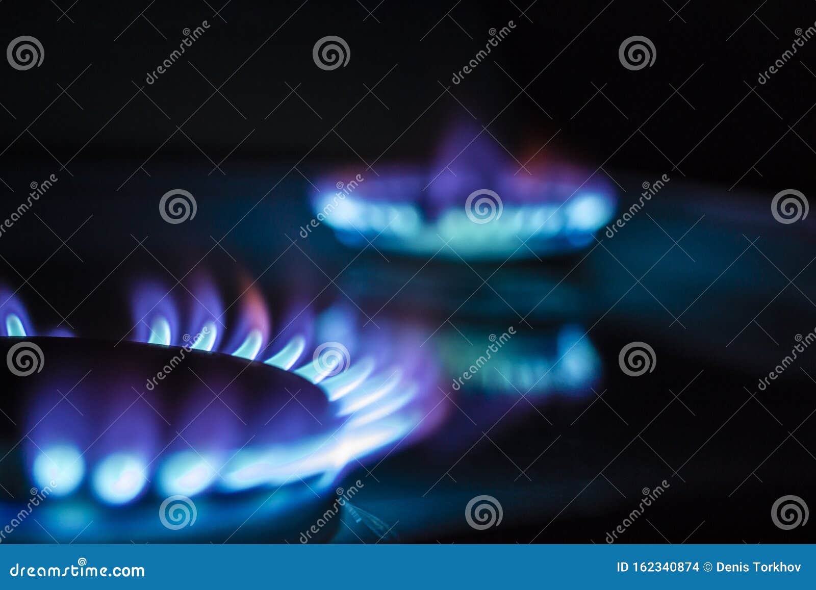 A Hundred Dollar Bill On A Gas Burner With A Burning Fire On A Black ...