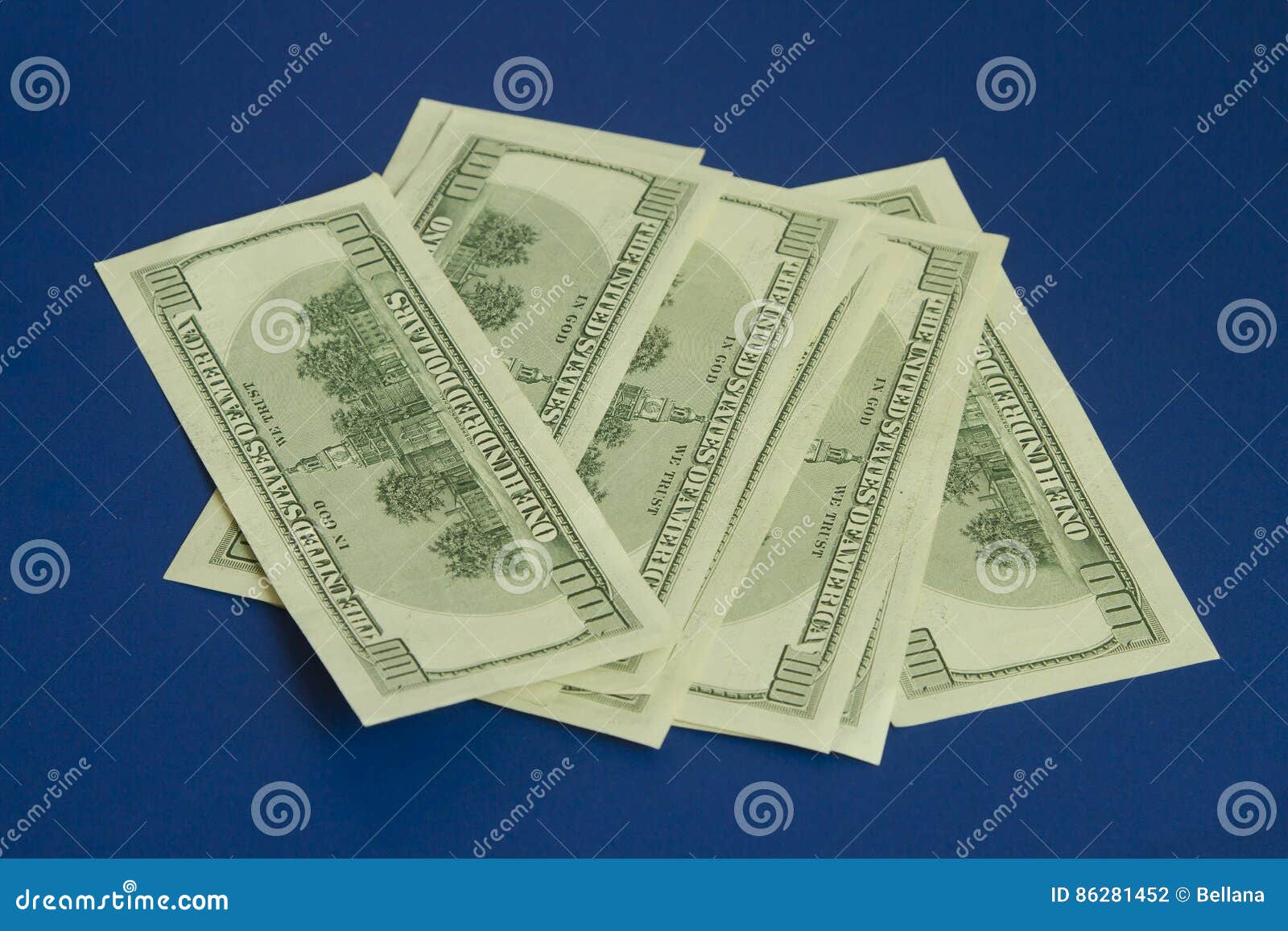 Hundred Dollar Bills On Dark Blue Background Stock Photo ...