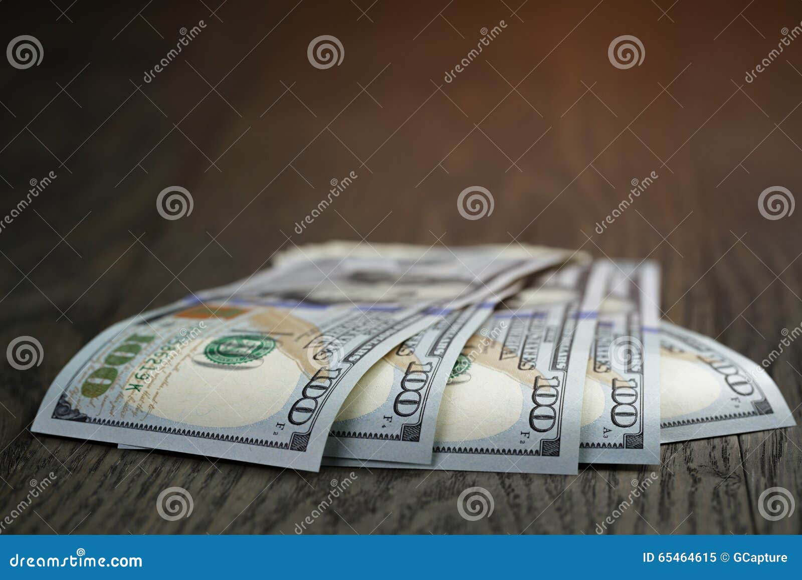 Hundred Dollar Bills on Wood Table Stock Image - Image of group, cash ...