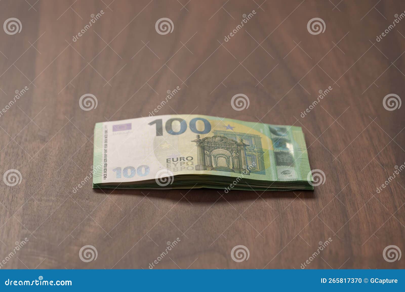 Hundred Euro Banknotes on a Walnut Table Stock Photo - Image of euro ...