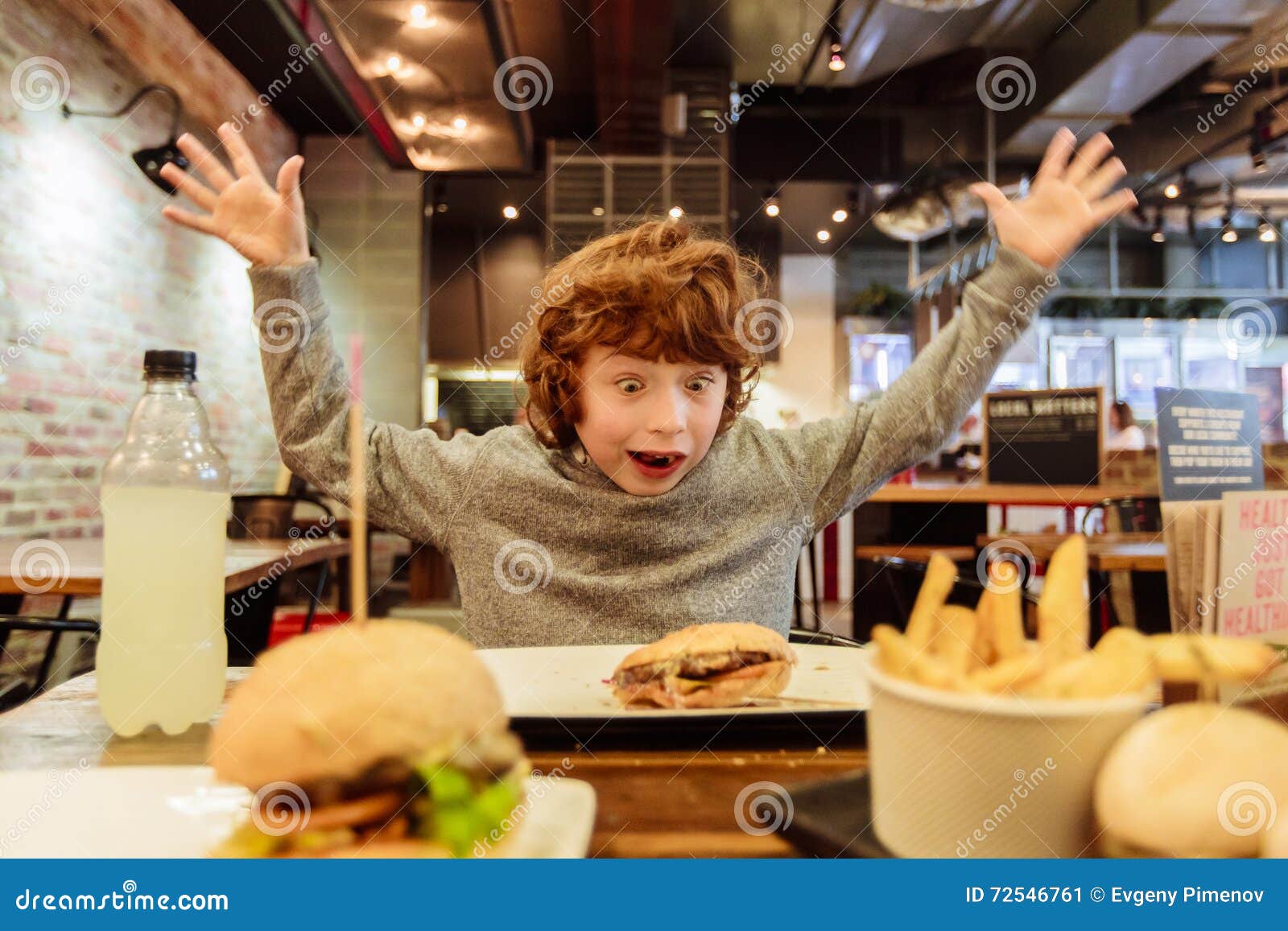 Hungry Boy Eats Burger in Restaurant Stock Image - Image of restaurant ...