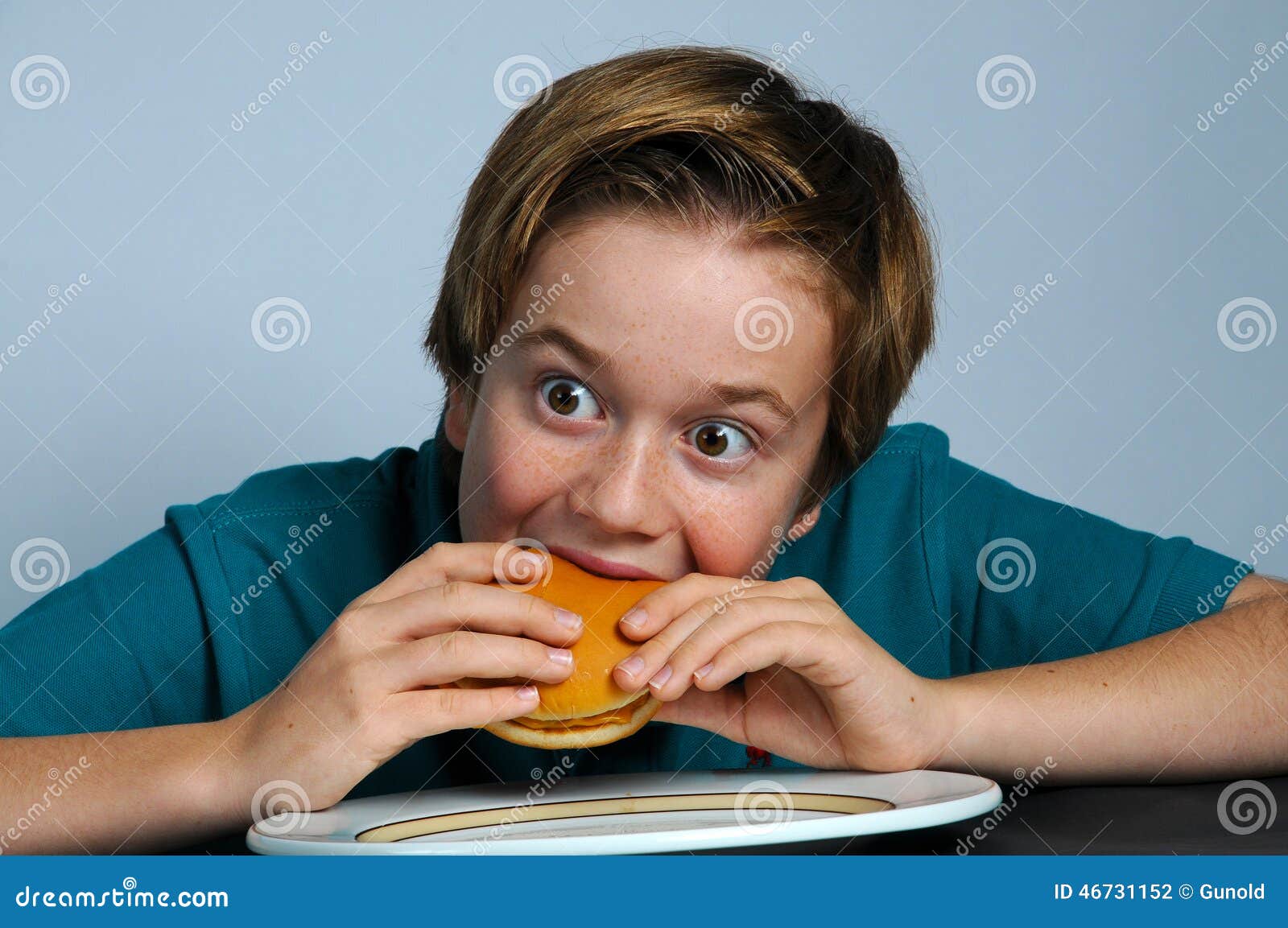 Hungry boy stock photo. Image of beefburger, pastry, mouth - 46731152