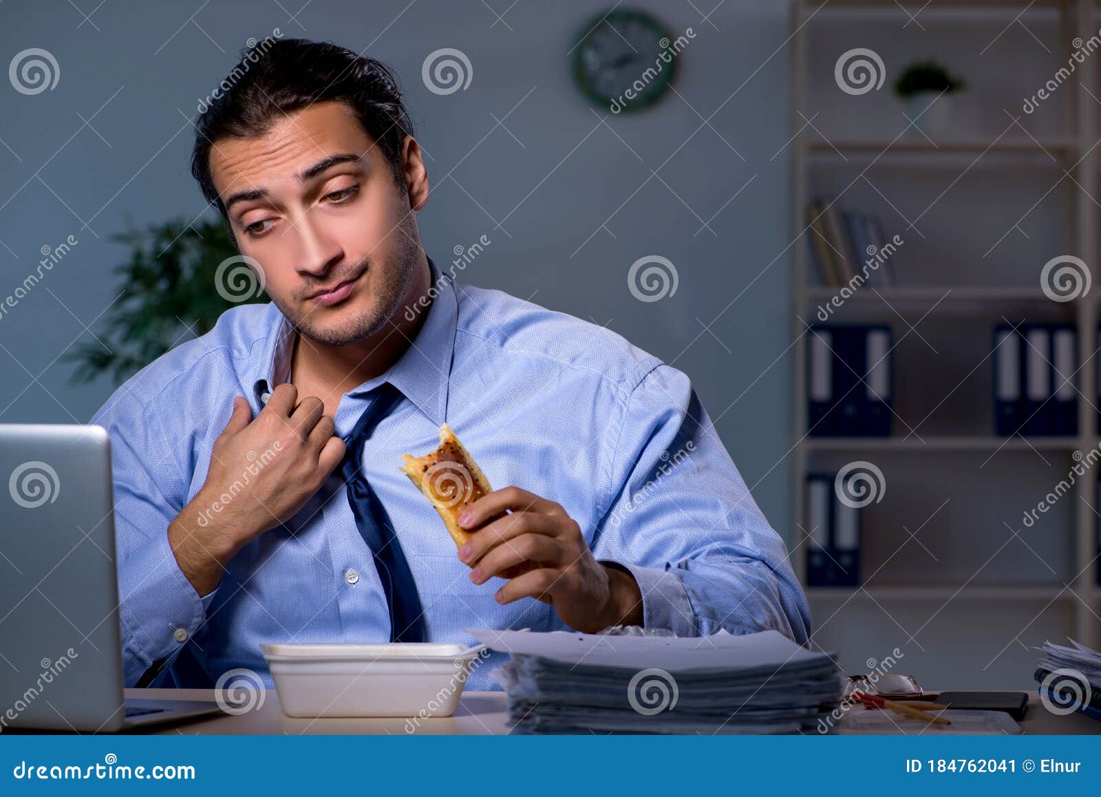 Hungry Employee Working Late in the Office Stock Image - Image of ...
