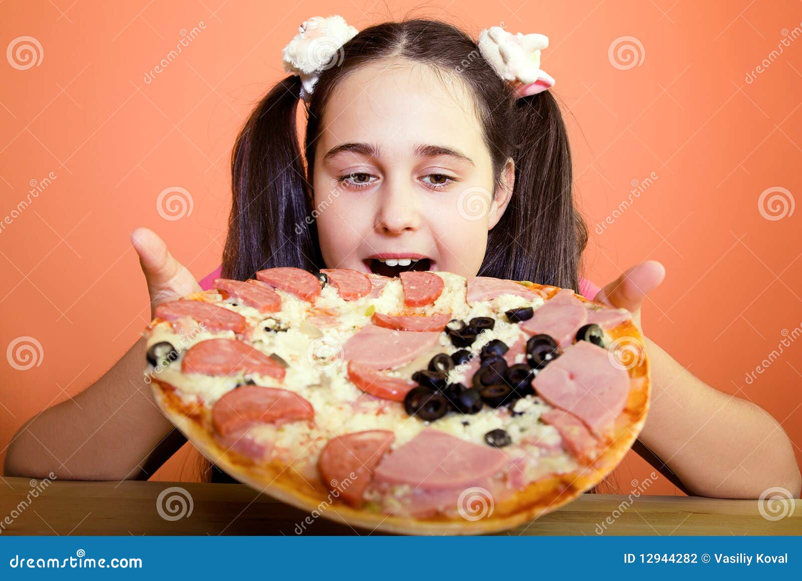 Hungry girl with pizza stock photo. Image of childhood - 12944282