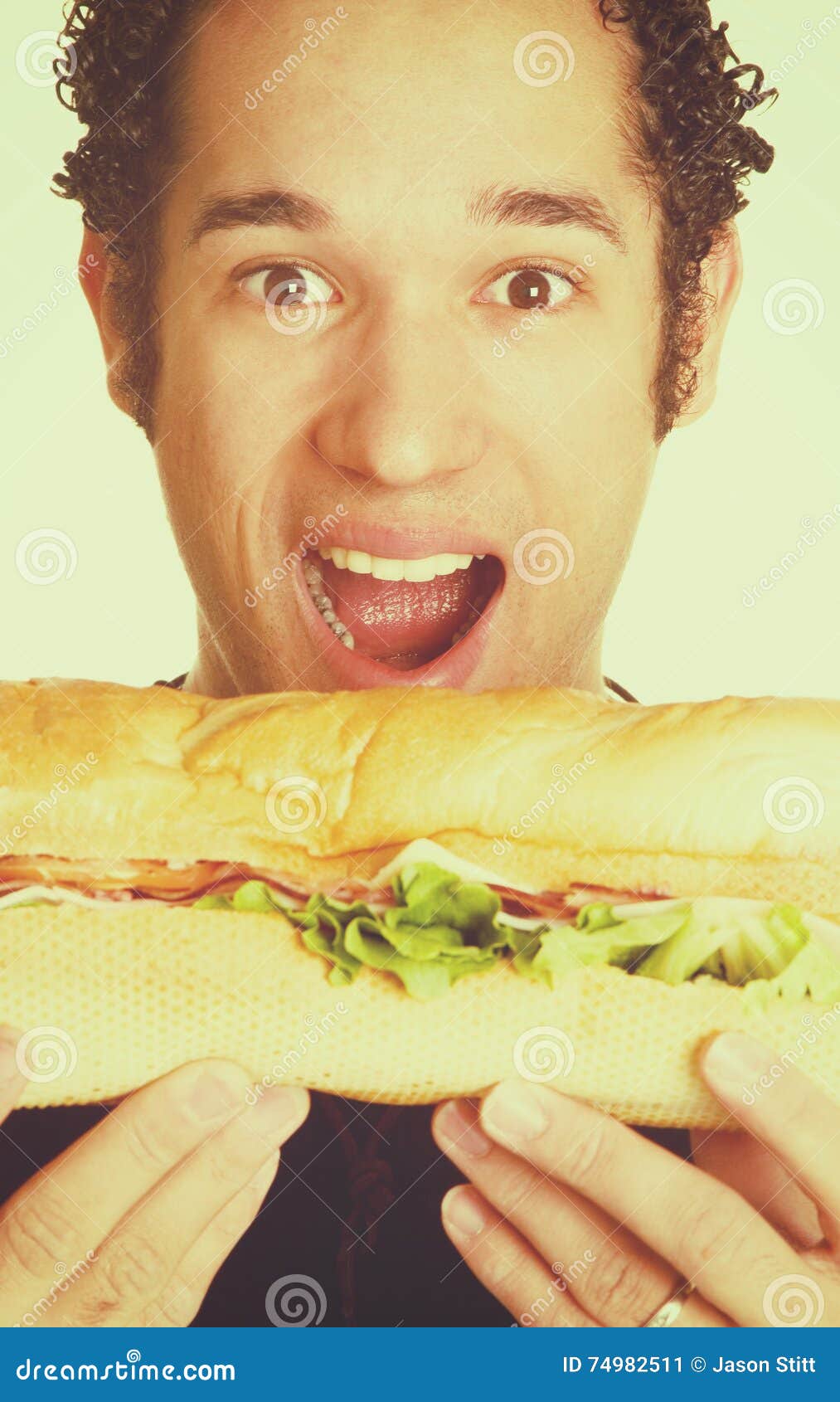 Hungry Man Eating stock image. Image of holding, hand - 74982511
