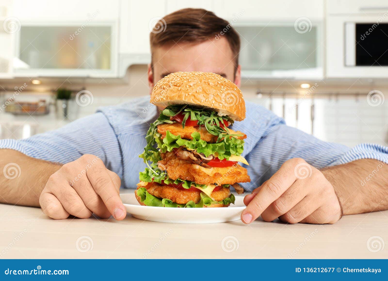 Hungry man and huge burger stock image. Image of hungry - 136212677