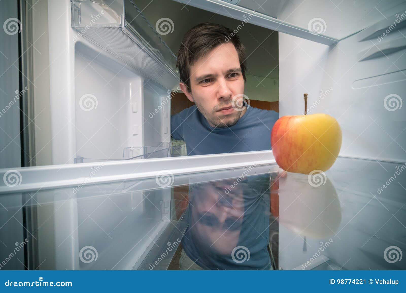 Hungry Man is Looking for Food in Fridge. only Apple is Inside Empty ...