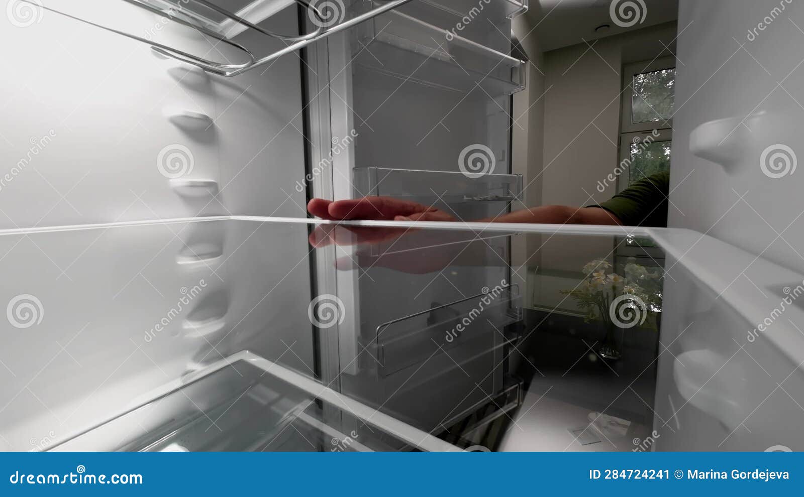 When Hungry, a Man Looks into the Refrigerator and Checks that it is ...