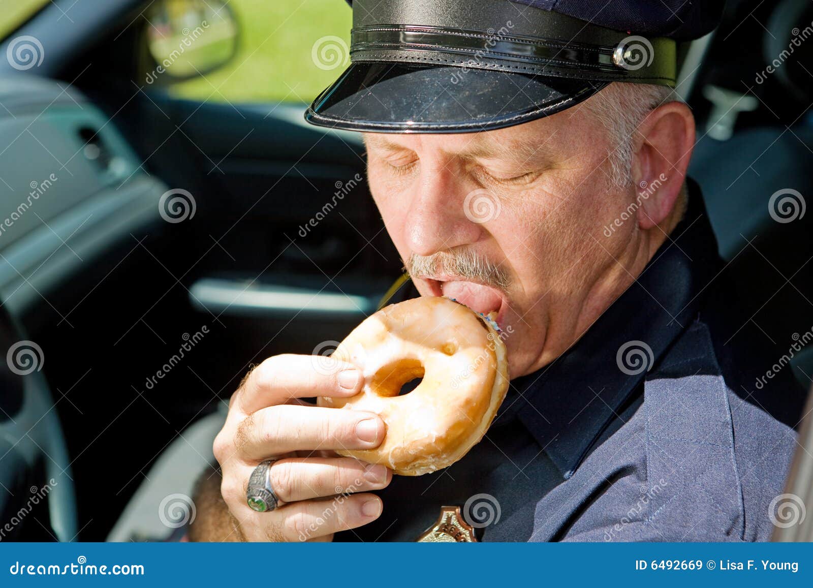 Hungry Police Officer stock image. Image of mature, officer - 6492669