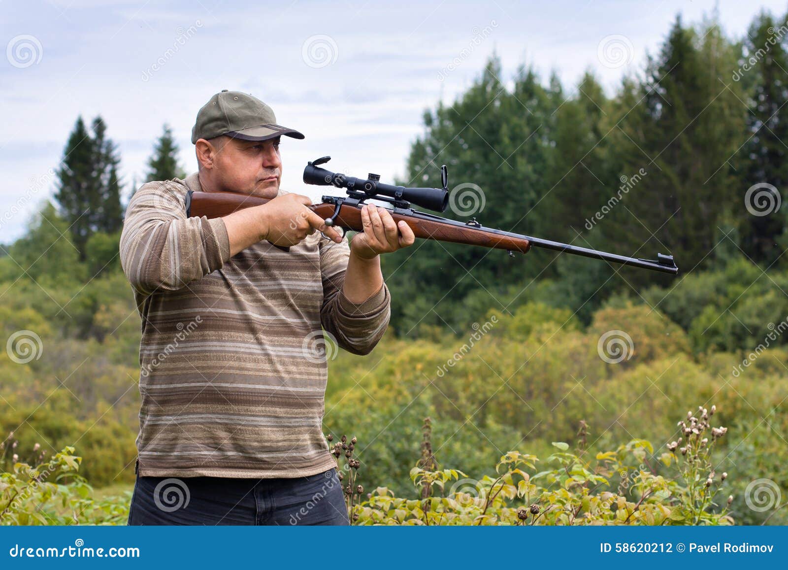 Hunter Aiming From A Rifle Stock Photo - Image: 58620212