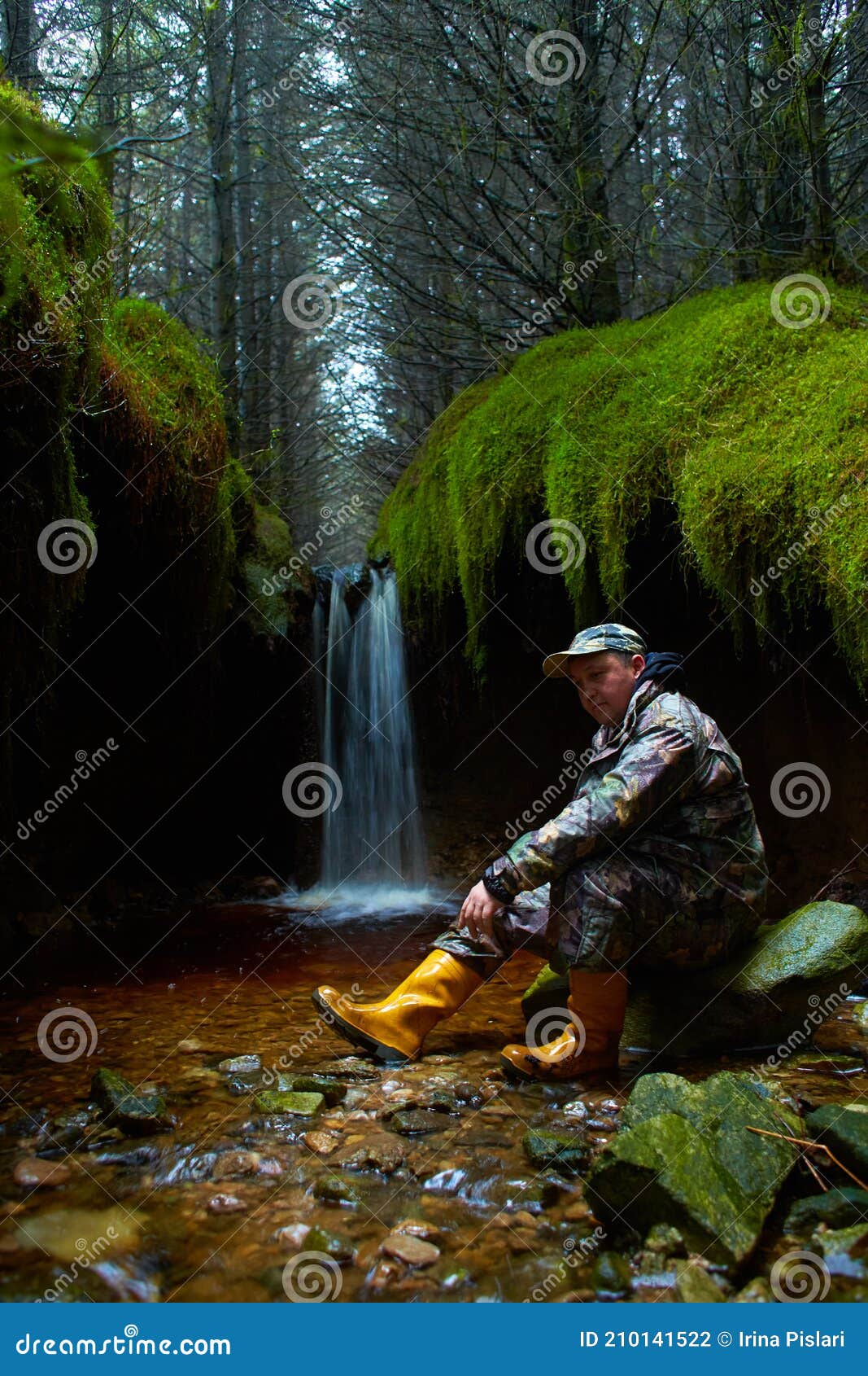 A Hunter in the Forest during the Day with Moss and Grass. Stock Photo ...