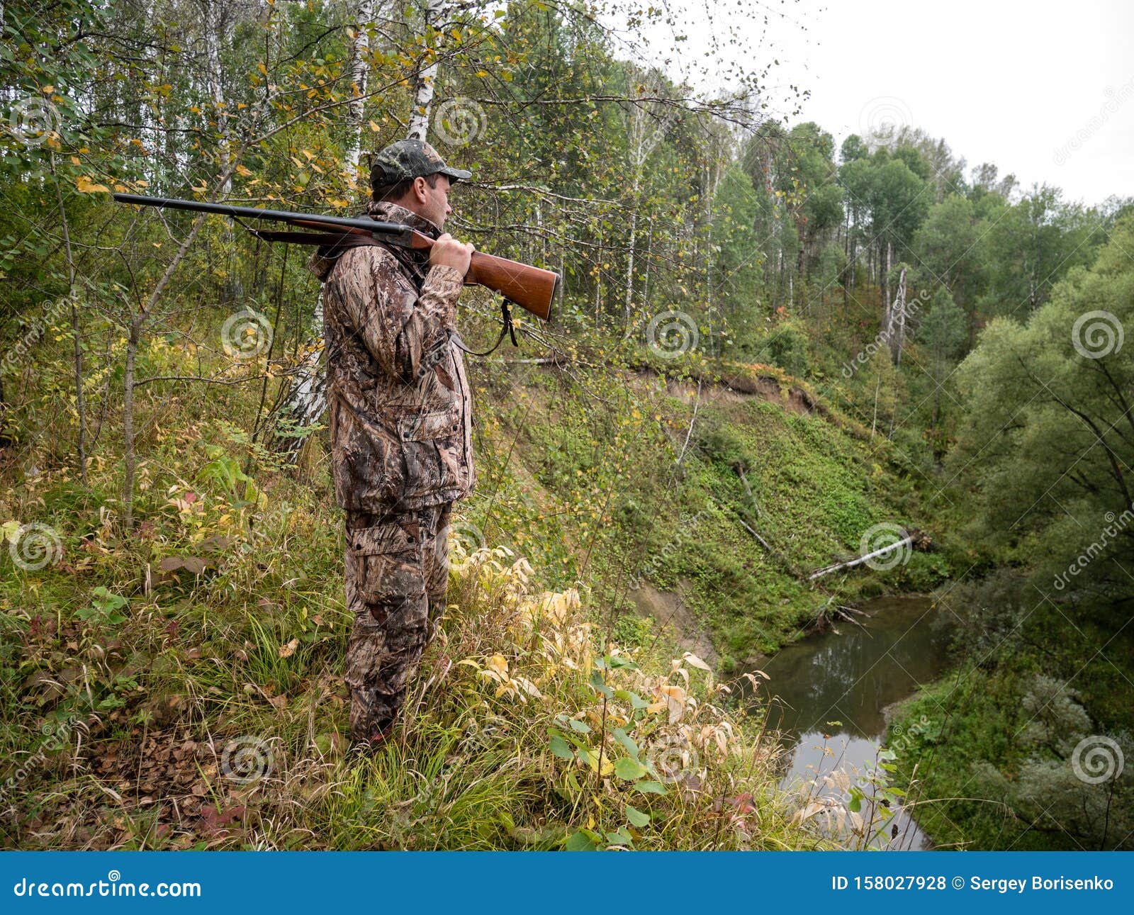 Hunter with a Gun in the Autumn Forest. Stock Photo - Image of season ...