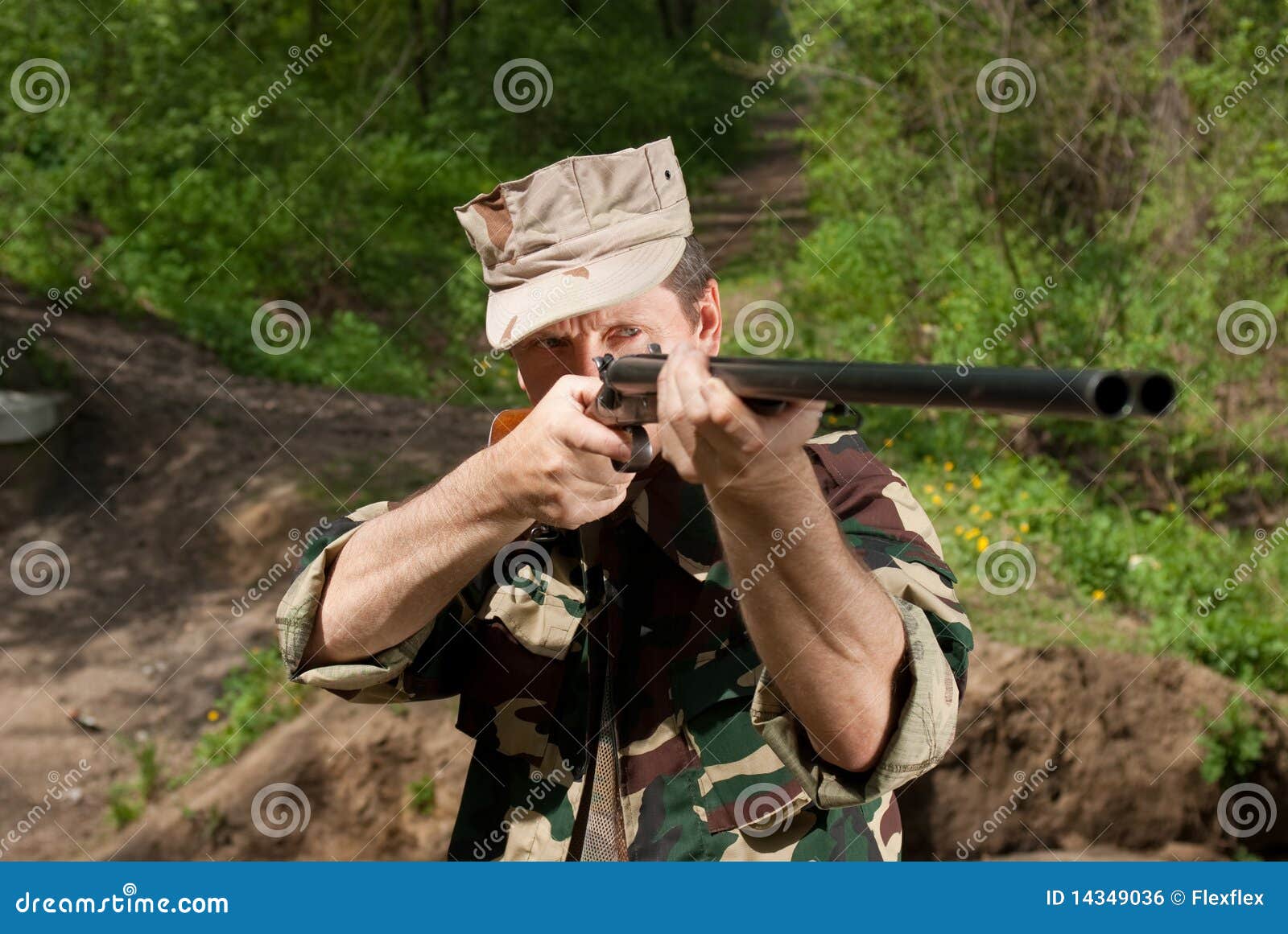 Hunter with gun in hand stock photo. Image of clothing - 14349036