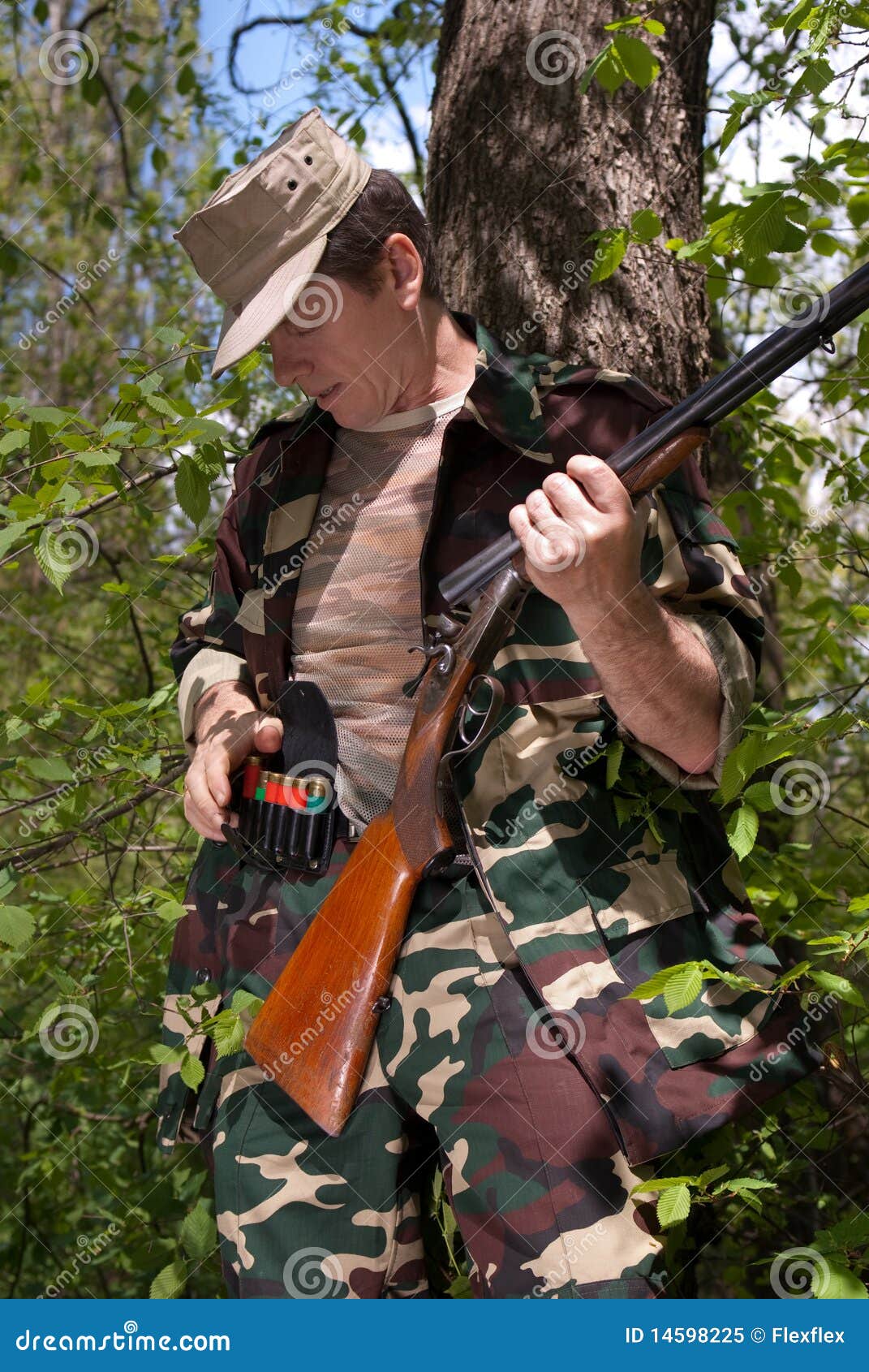 Hunter with gun in hands stock image. Image of shooting - 14598225