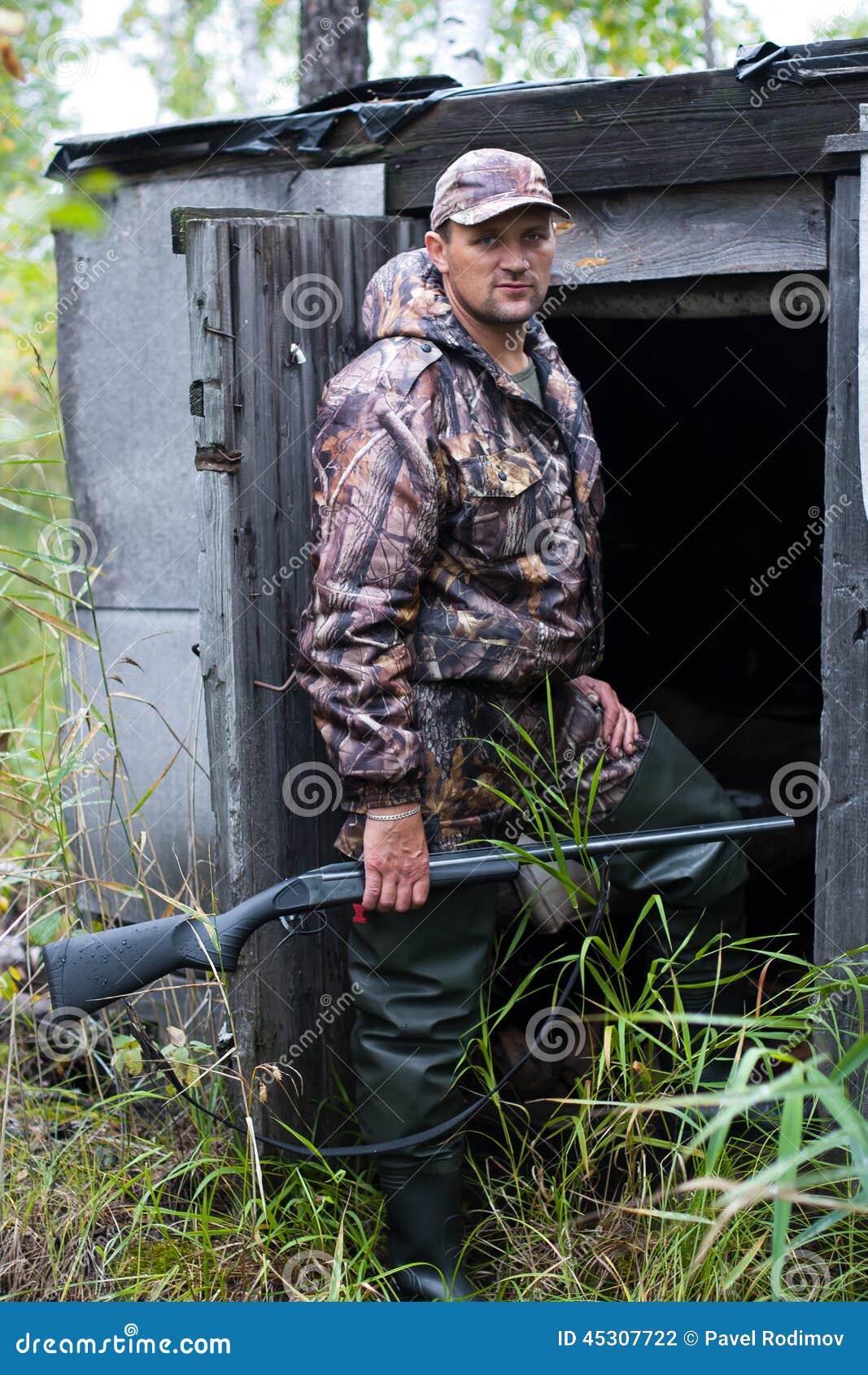 Hunter at the hut stock photo. Image of horizontal, house - 45307722