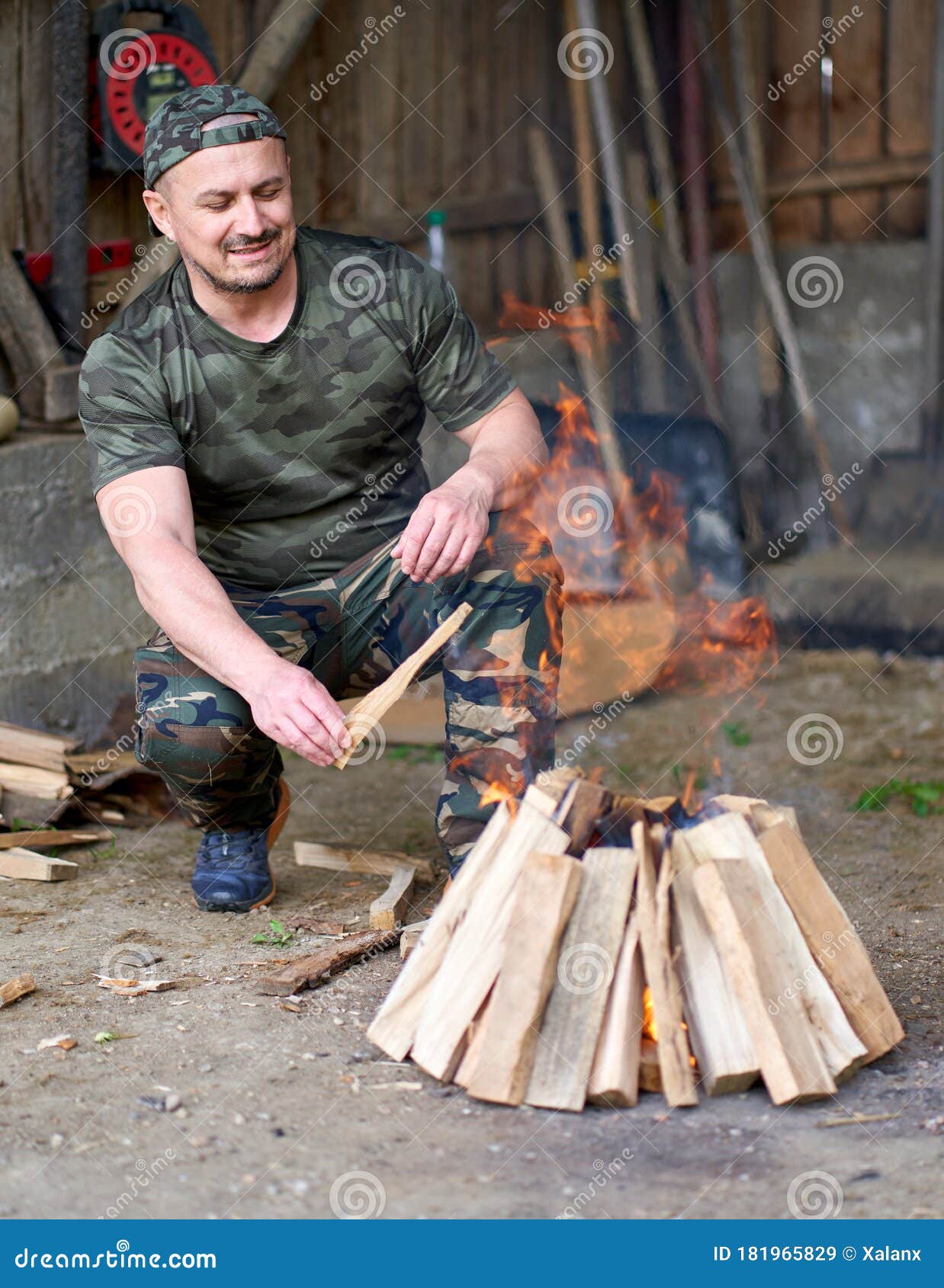 Hunter Lighting Fire for Barbeque Stock Image - Image of close, hunter ...