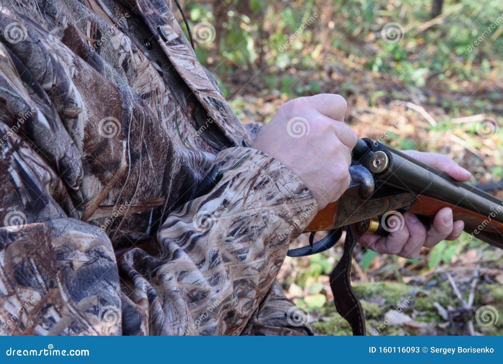Hunter, loading a gun. stock image. Image of rifle, loads - 160116093