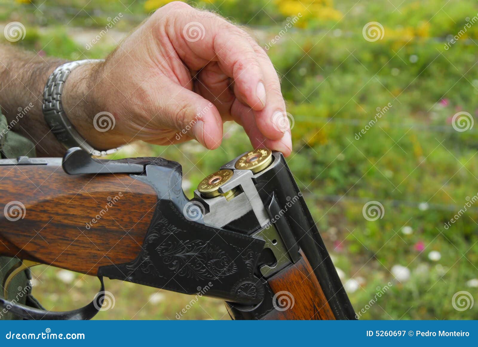 Hunter loading his weapon stock image. Image of rifle - 5260697