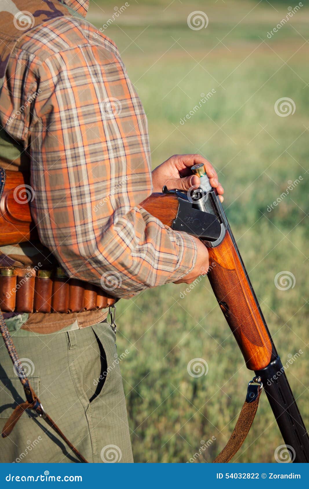 Hunter loading shotgun stock photo. Image of ammunition - 54032822