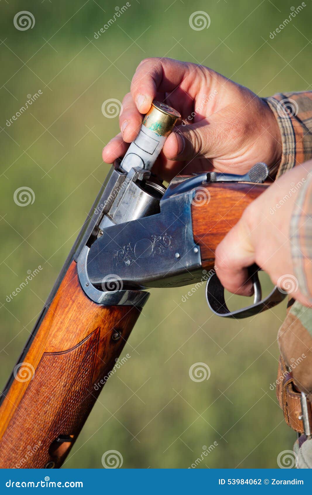 Hunter loading shotgun stock photo. Image of loading - 53984062