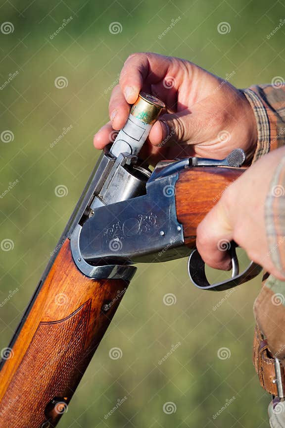 Hunter loading shotgun stock photo. Image of loading - 53984062