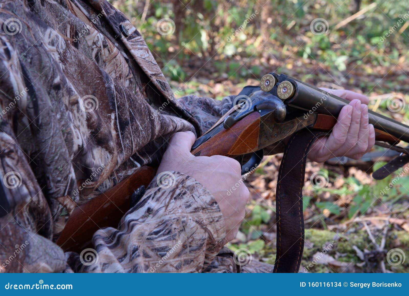 Hunter, loading a gun. stock photo. Image of lifestyles - 160116134