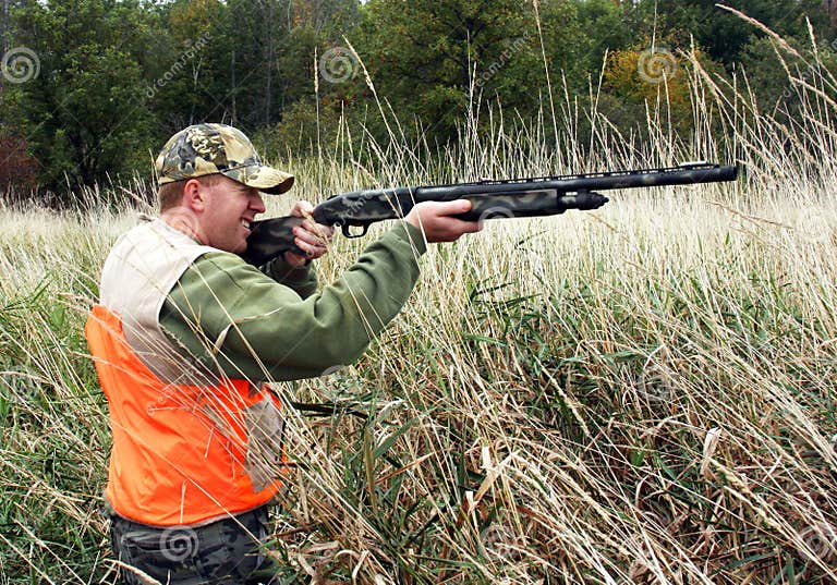 Hunter in Orange Safety Vest Stock Photo - Image of marsh, hunter: 12460750