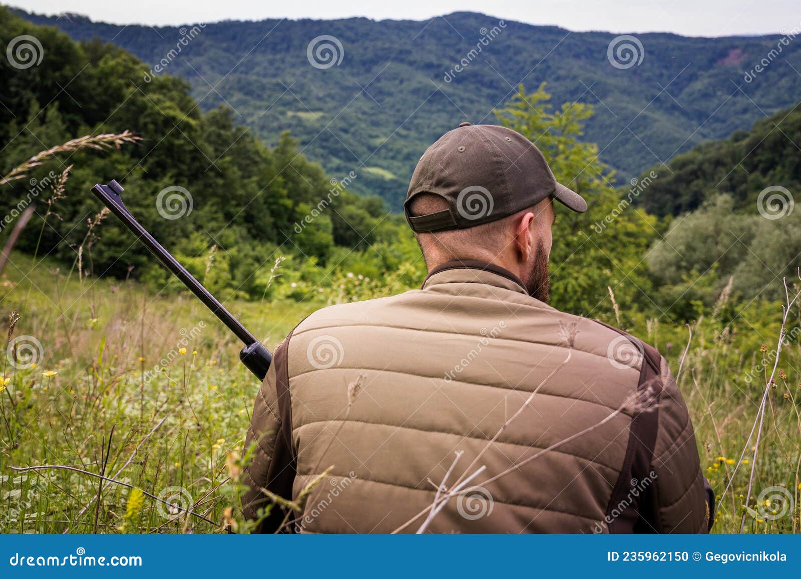 A Hunter Patiently Waiting with His Rifle Stock Photo - Image of people ...