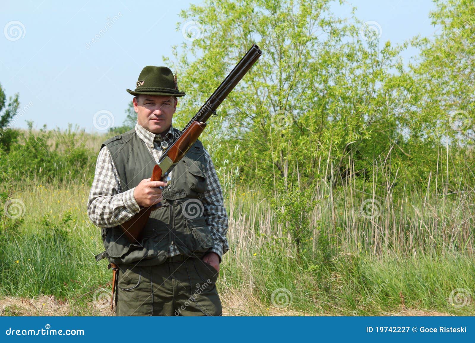 Hunter posing with shotgun stock image. Image of posing - 19742227