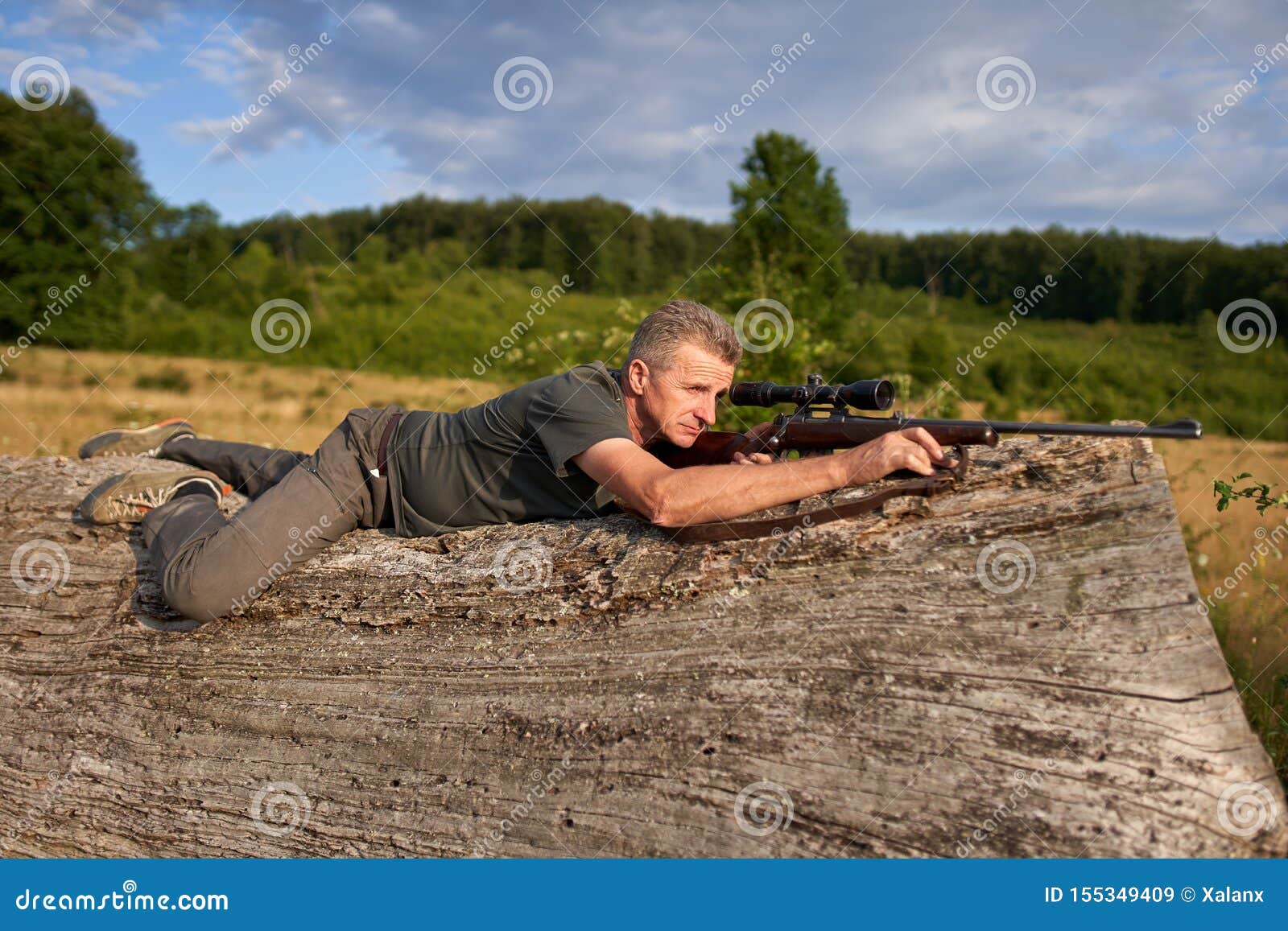 Hunter With Rifle Ready To Hunting Nature Background. Hunting Skills ...