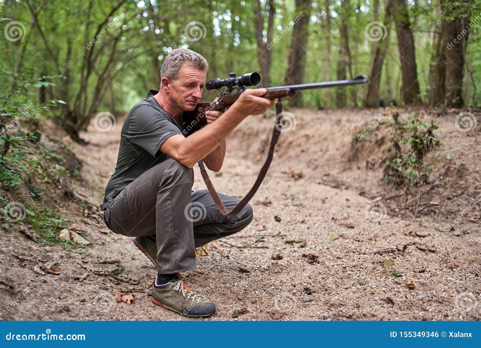 Hunter with rifle stock photo. Image of trees, green - 155349346