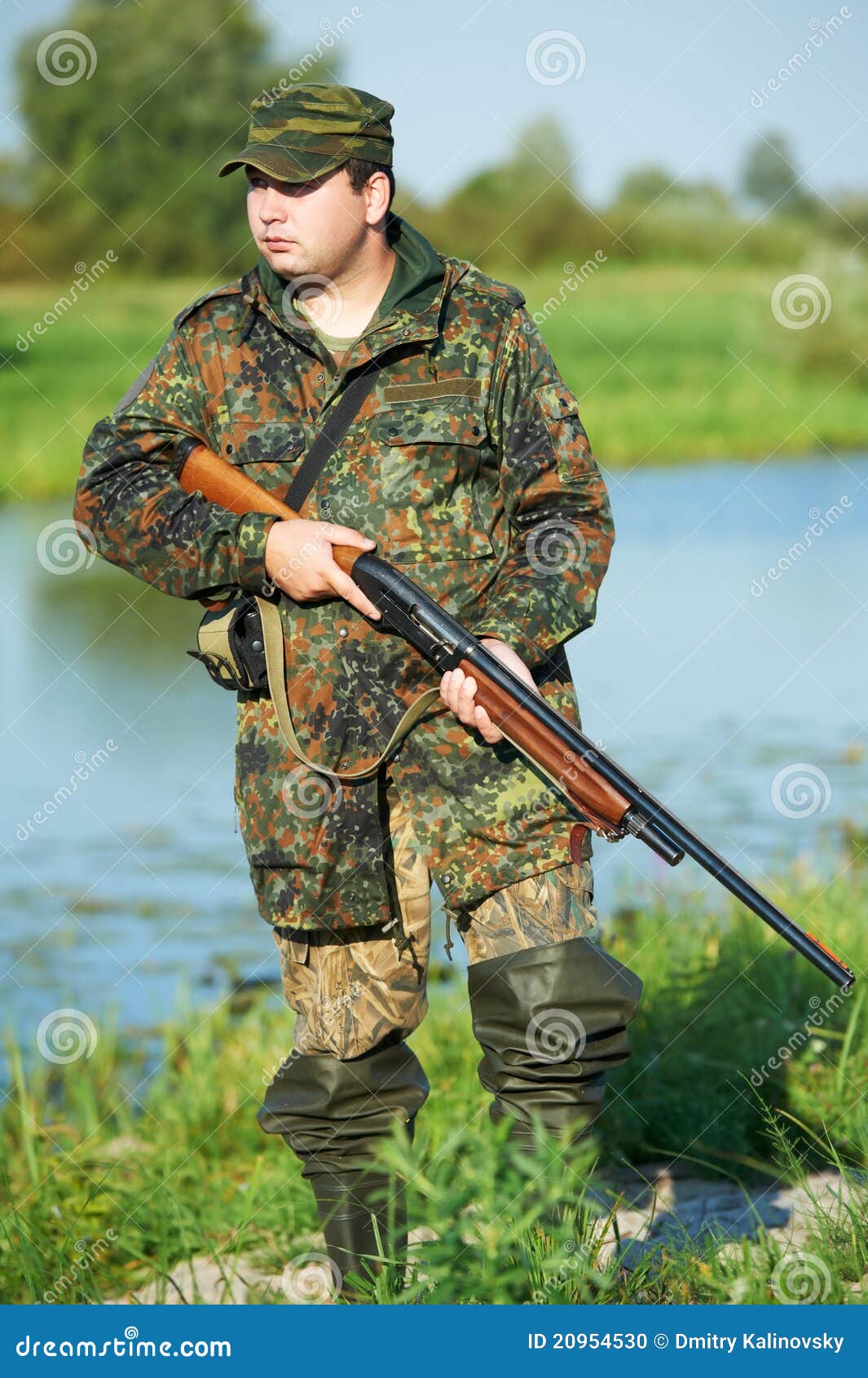 Hunter with rifle gun stock photo. Image of hobby, camo - 20954530