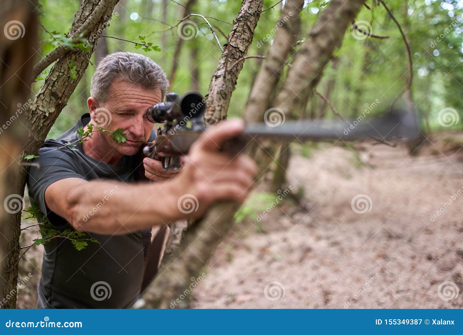 Hunter With Rifle Ready To Hunting Nature Background. Hunting Skills ...
