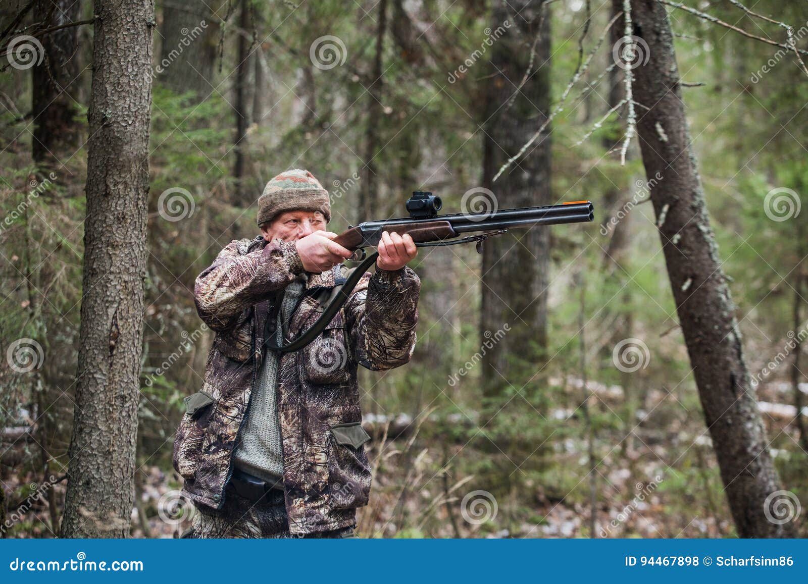 Hunter shoots a gun stock photo. Image of equipment, season - 94467898