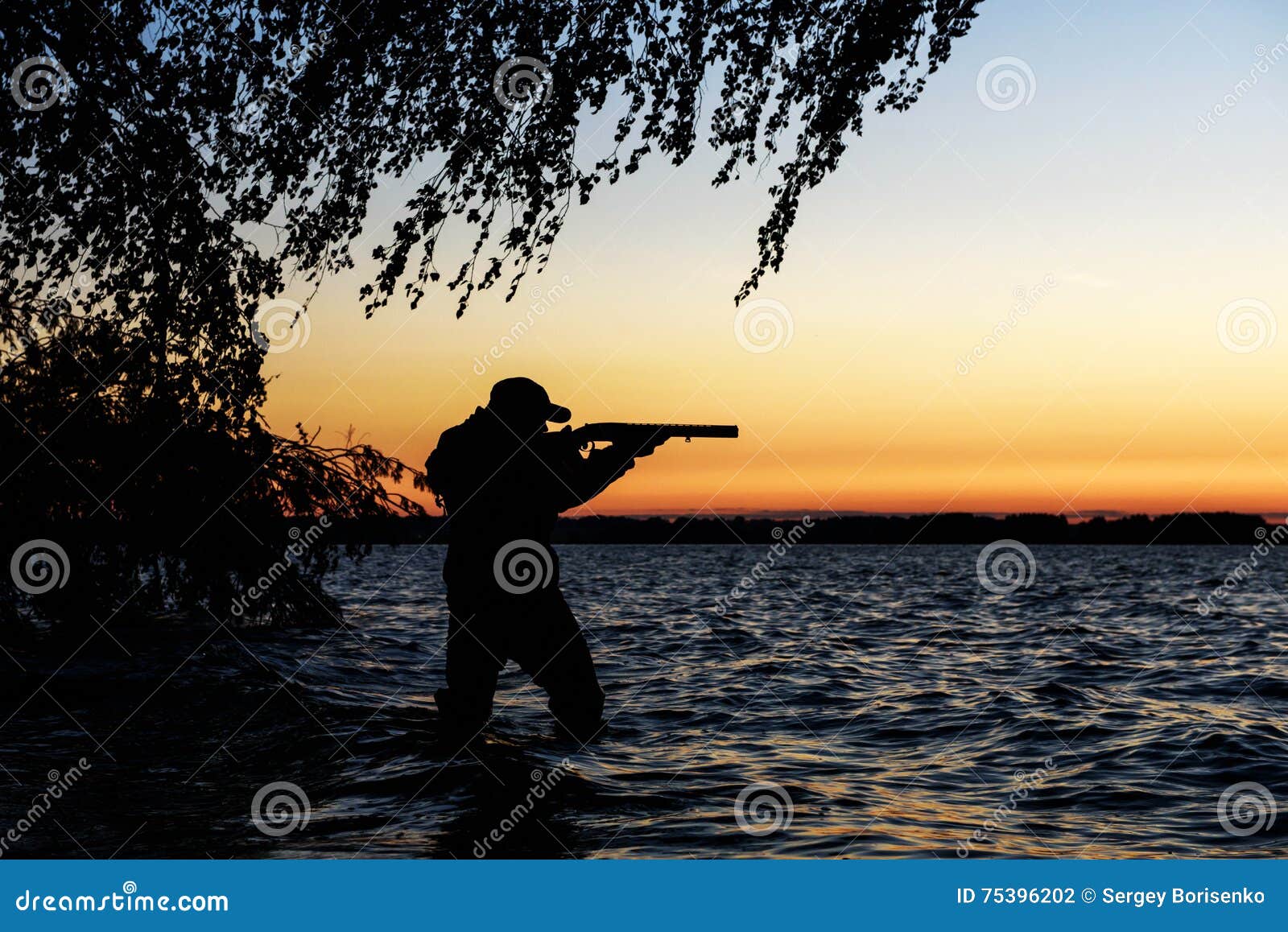 Hunter Silhouette at Sunset Stock Photo - Image of grass, colorful ...