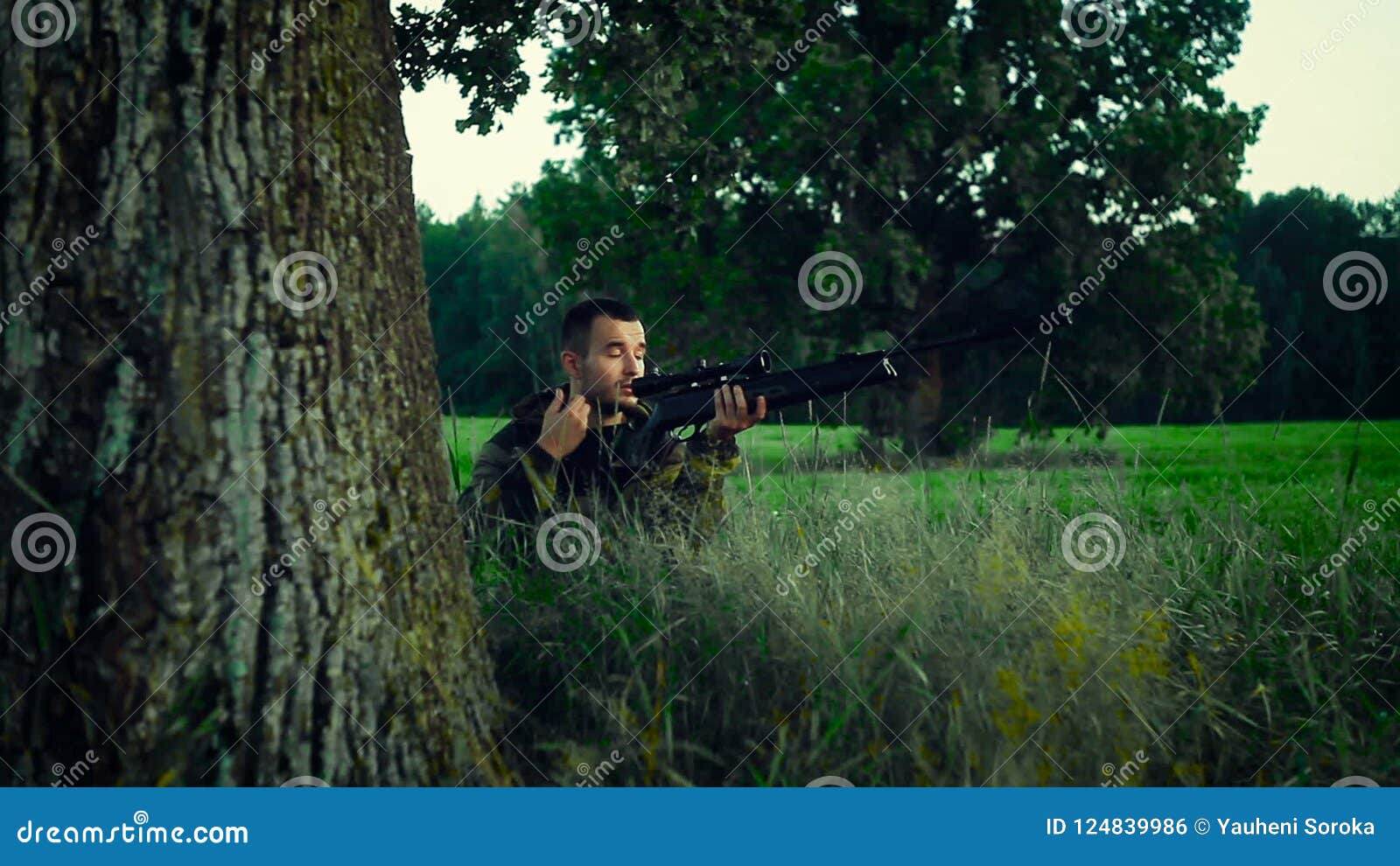 Hunter Sitting Under a Tree and Aim at Prey Stock Footage - Video of ...