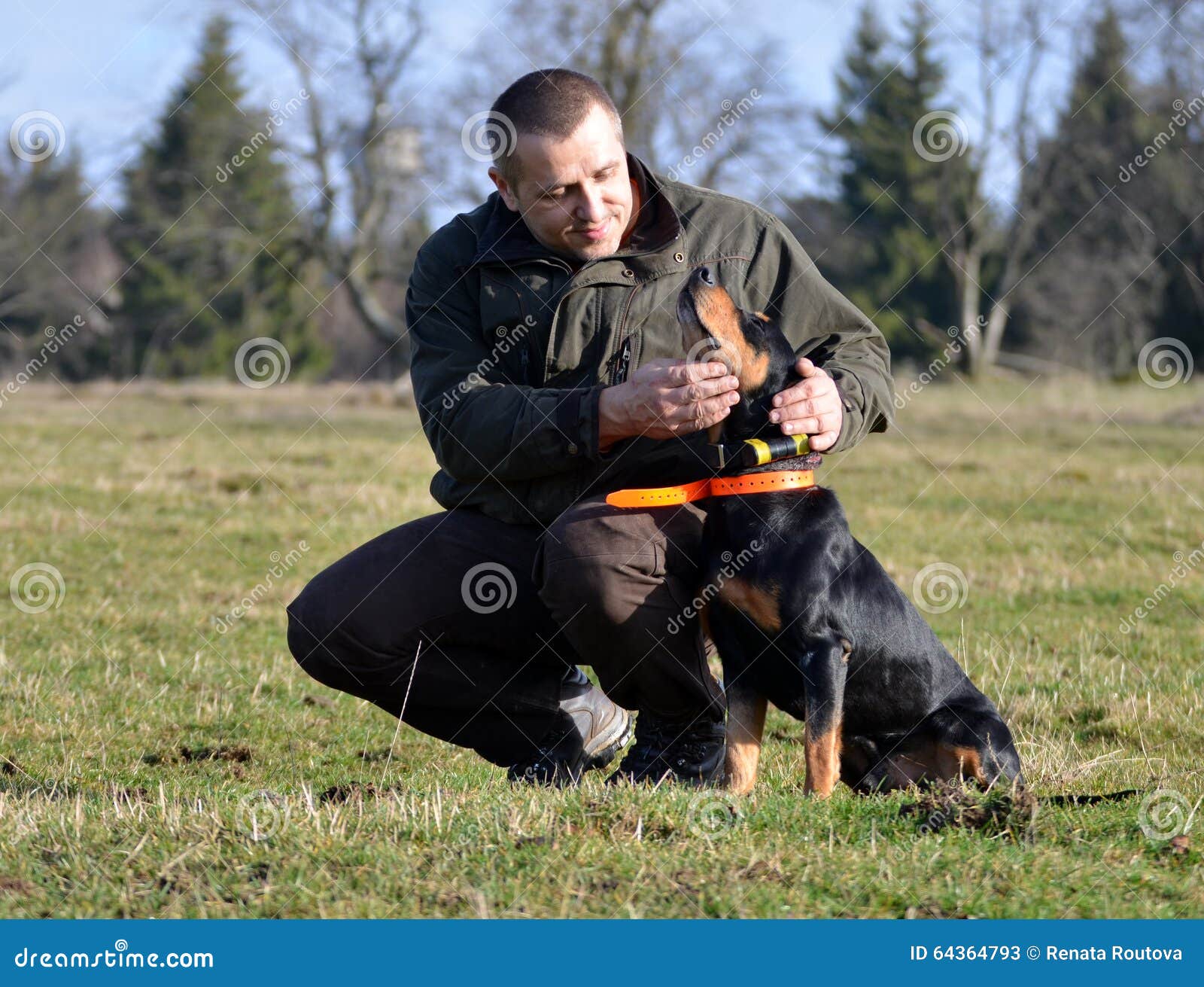 Hunter strokes his dog stock image. Image of leiss, outdoor - 64364793