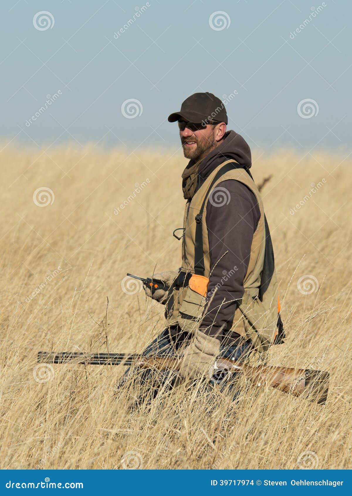Hunter in tall grass stock photo. Image of shotgun, south - 39717974