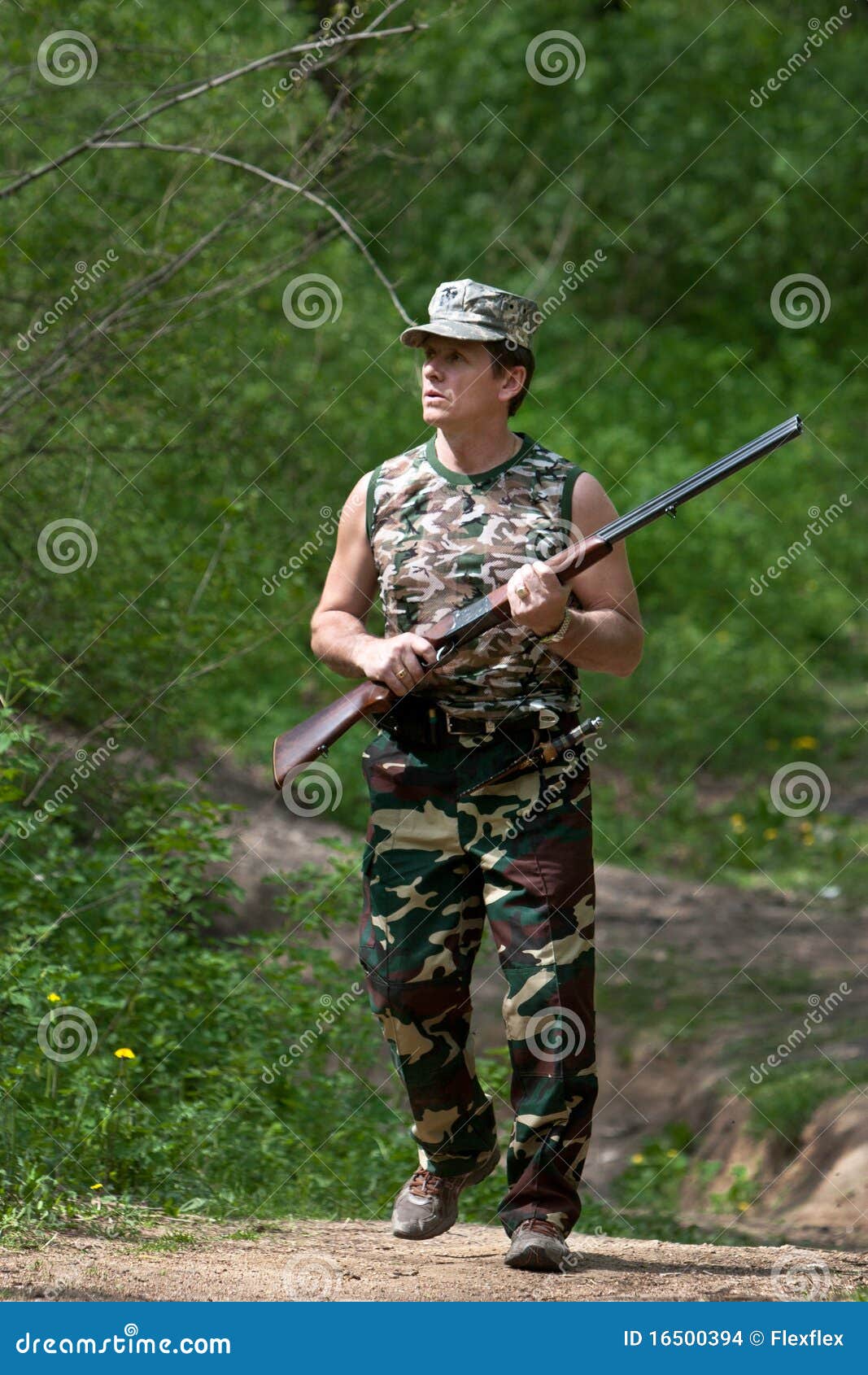 Hunter walking with rifle stock photo. Image of male - 16500394