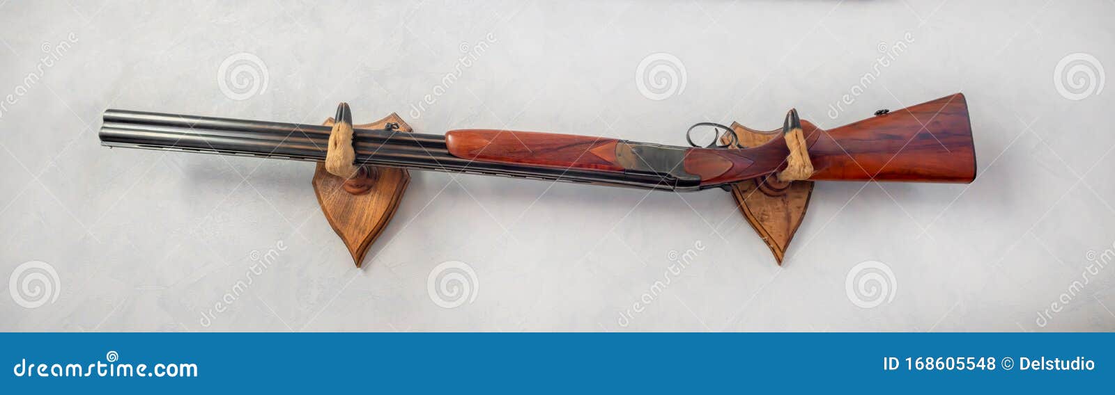 Hunting Rifle Hanging on a Wall with Deer Foot Gun Rack Stock Photo ...