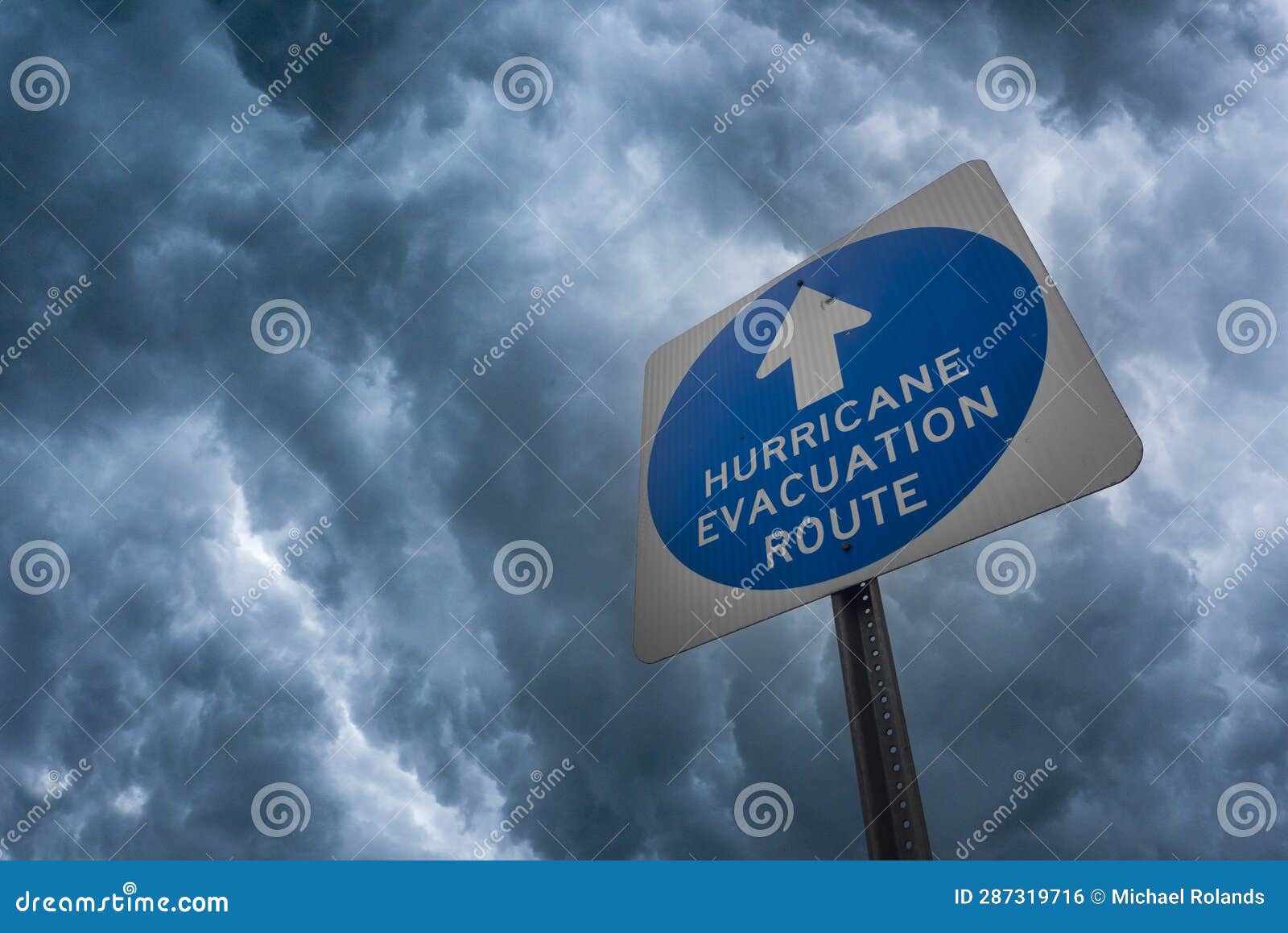 Hurricane Evacuation Sign Against a Stormy Sky Stock Photo - Image of ...