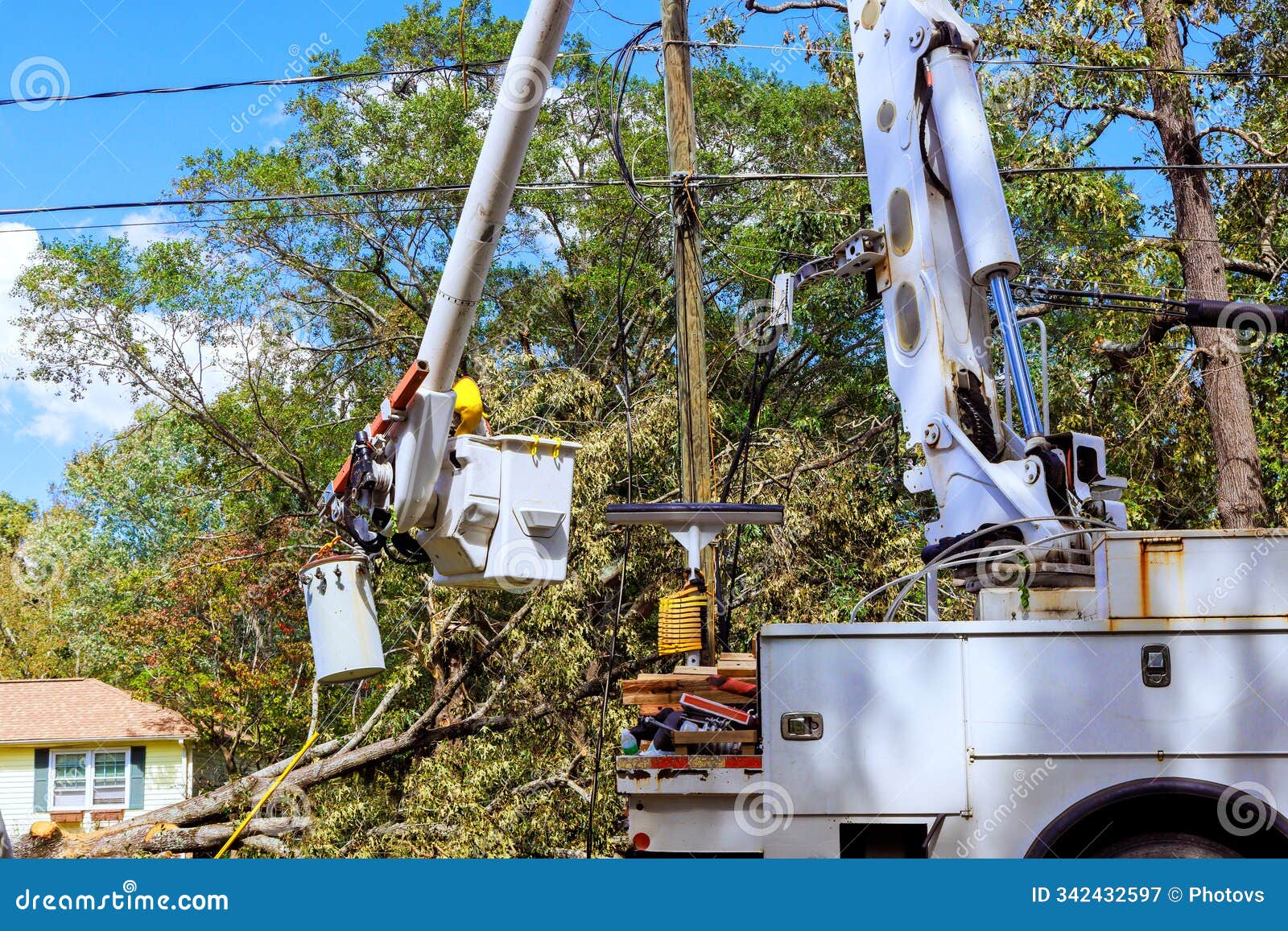 After Hurricane, Technician Works on an Electrical Pole Using a Bucket ...