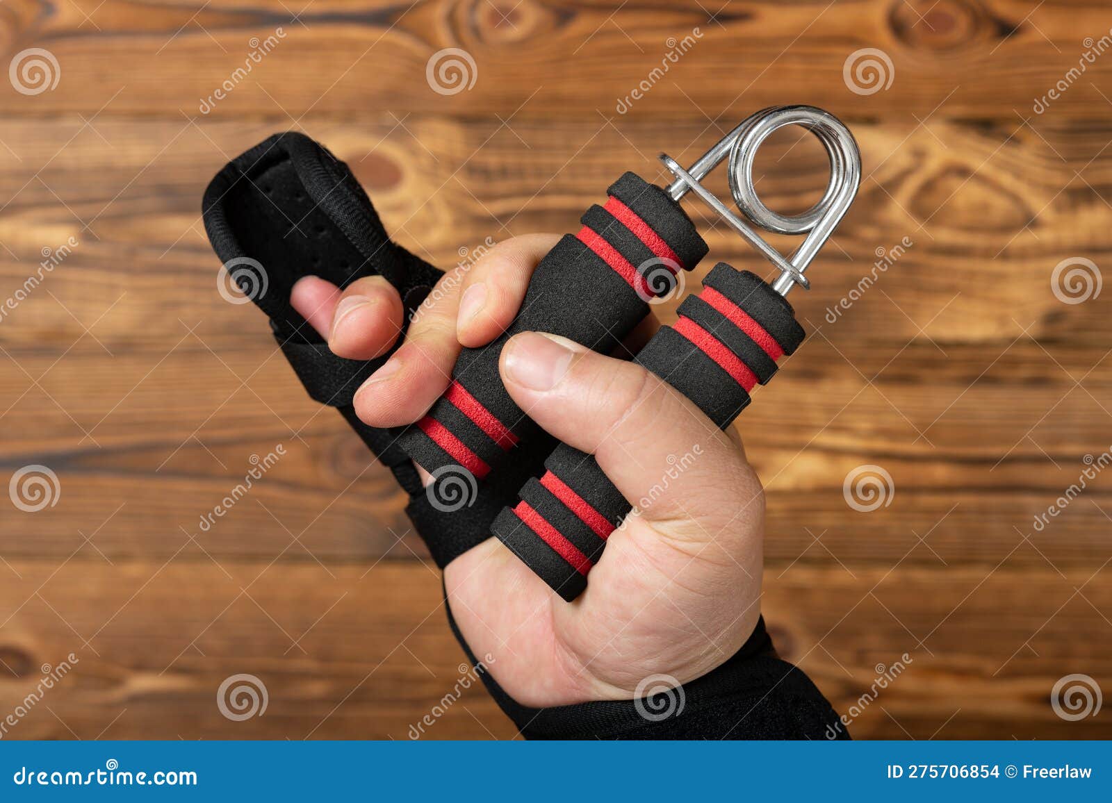 A Hurt Hand Doing Rehabilitation Exercises by Squeezing an a Shape Hand ...