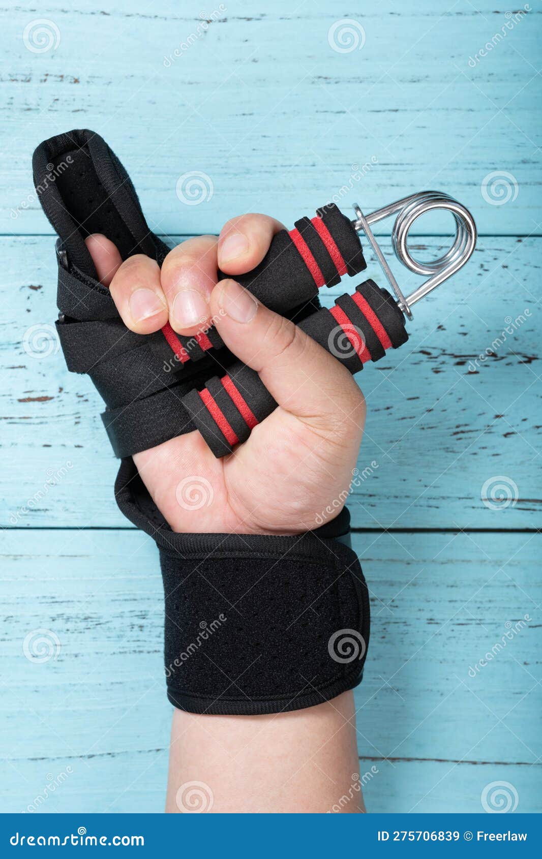 A Hurt Hand Doing Rehabilitation Exercises by Squeezing an a Shape Hand ...